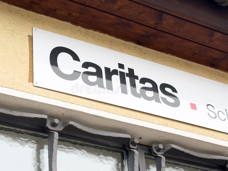 Caritas Sign on Building Exterior with Rustic Details Editorial Image ...