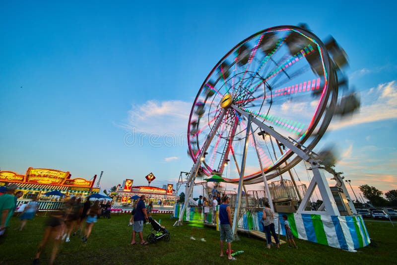 Carnival County Fair with Ferris Wheel Attraction at Dusk Editorial ...