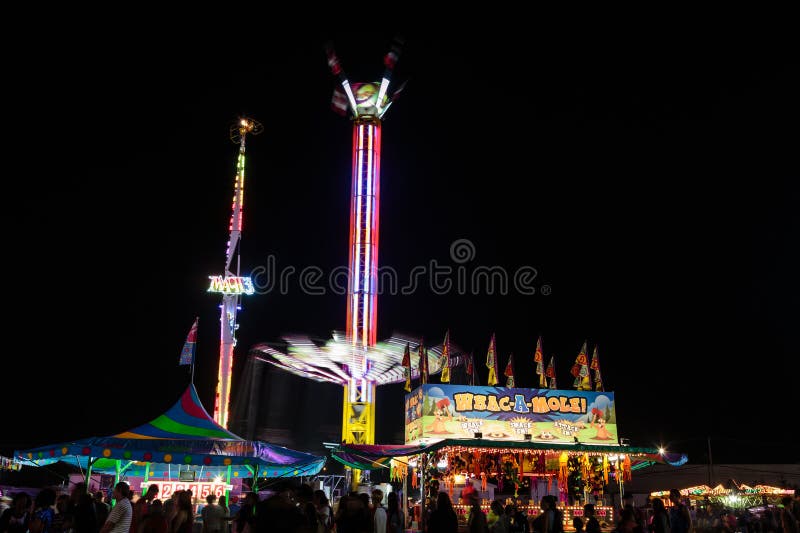 A Carnival with a Lot of People and a Tall Ride Editorial Photo - Image ...