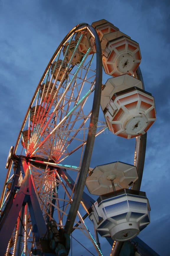 Carnival ride at dusk stock image. Image of wheel, spin - 16893665