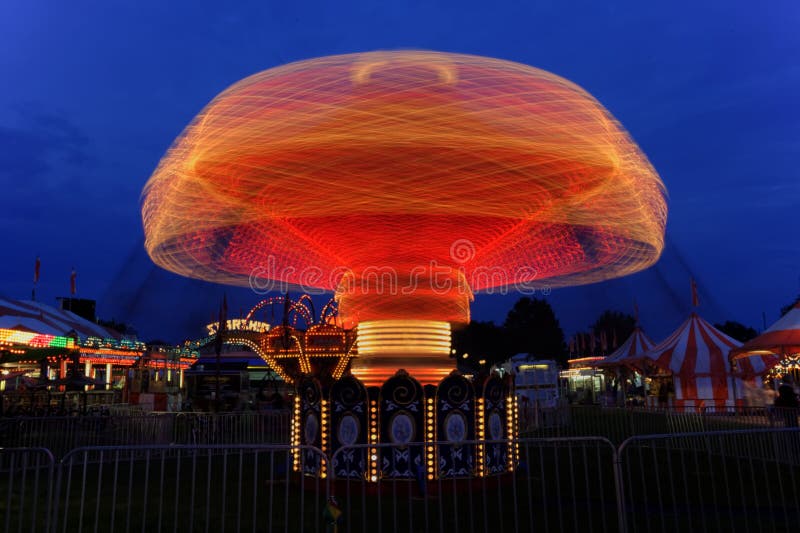 Ride at Fair Spinning Around with People Having Fun Stock Image - Image ...