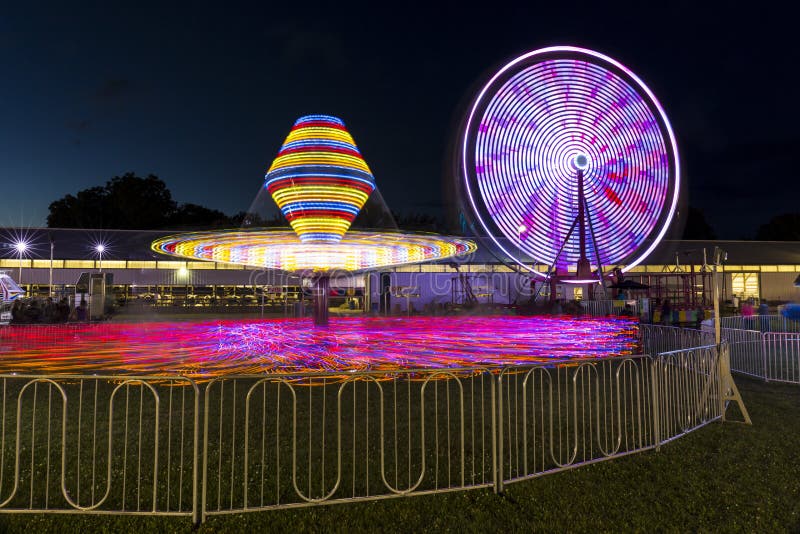 Carnival Rides in Motion stock image. Image of circle - 76369345