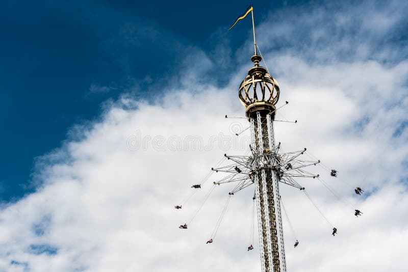 Carousel in the Air Towards a Blue Sky with Clouds Stock Image - Image ...