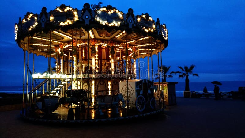 Carousel on the Beach in the Rain Stock Photo - Image of attraction ...