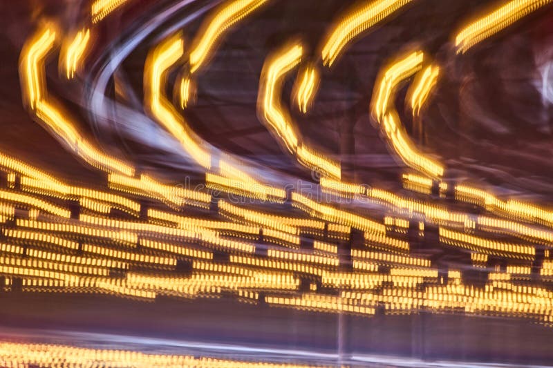 Carousel with Dynamic Light Trails in Urban Night Setting Stock Image ...
