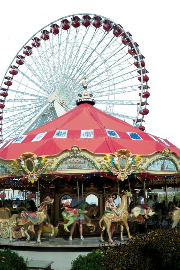 Carousel and ferris wheel stock photo. Image of children - 84968480