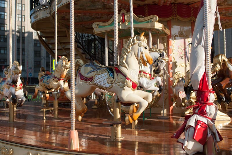 Horses on a Carnival Merry Go Round. Old French Carousel in a Holiday ...