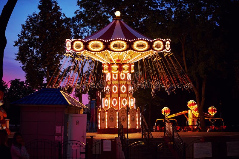 Carousel Merry Go Round in Amusement Park at Evening City Stock Photo ...