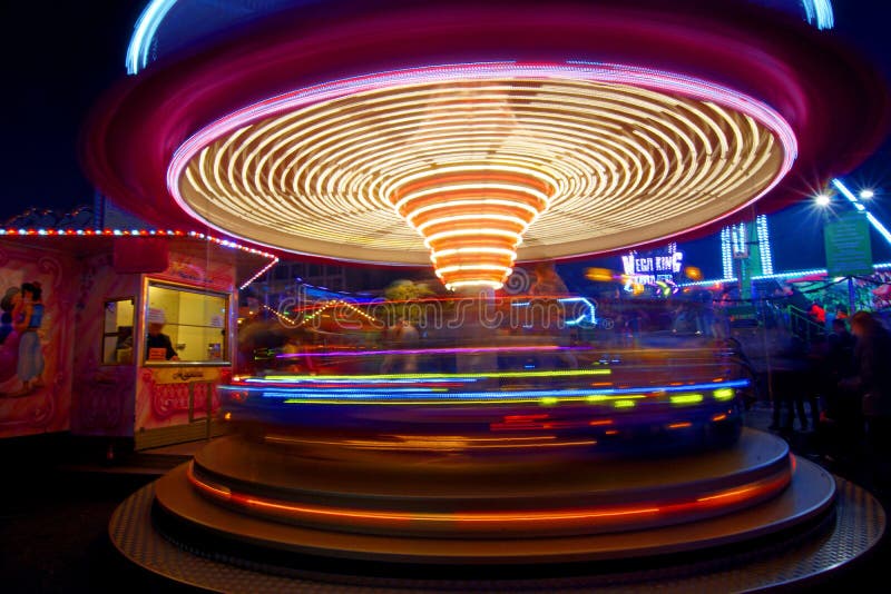 Carousel in Neon Light on a Fairground Editorial Stock Photo - Image of ...