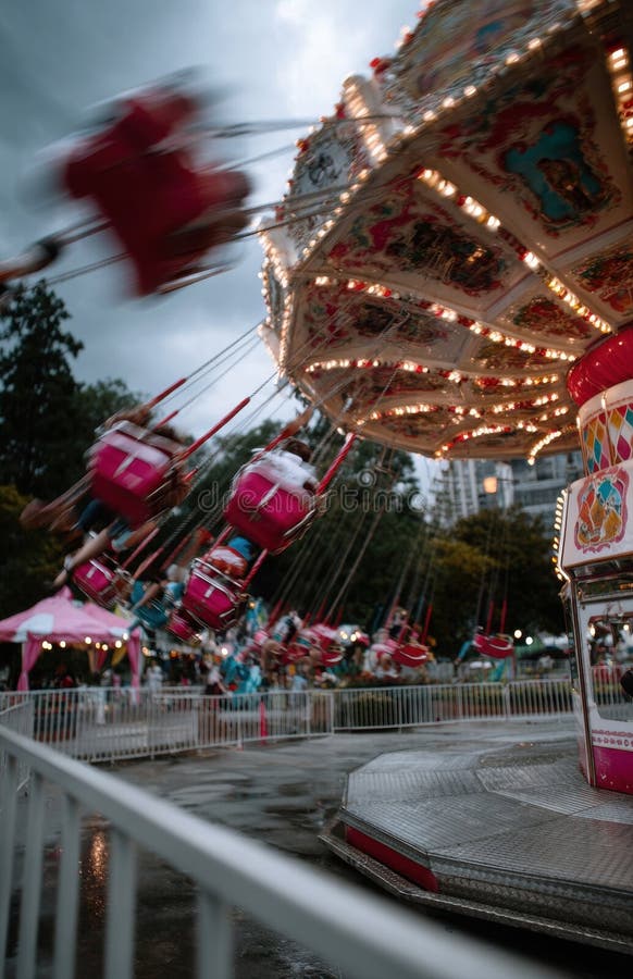 Carousel Swing Ride Spinning at an Amusement Park with Motion Blur ...