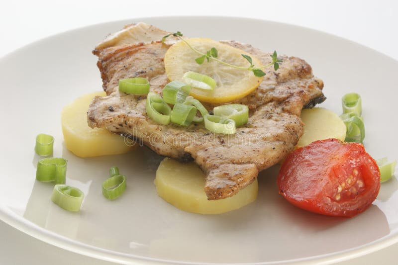 Carp Steak with Potato and Tomato Stock Image - Image of potato, bacon ...