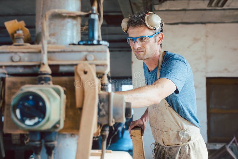 Carpenter Adjusting the Machine Planer Stock Photo - Image of german ...