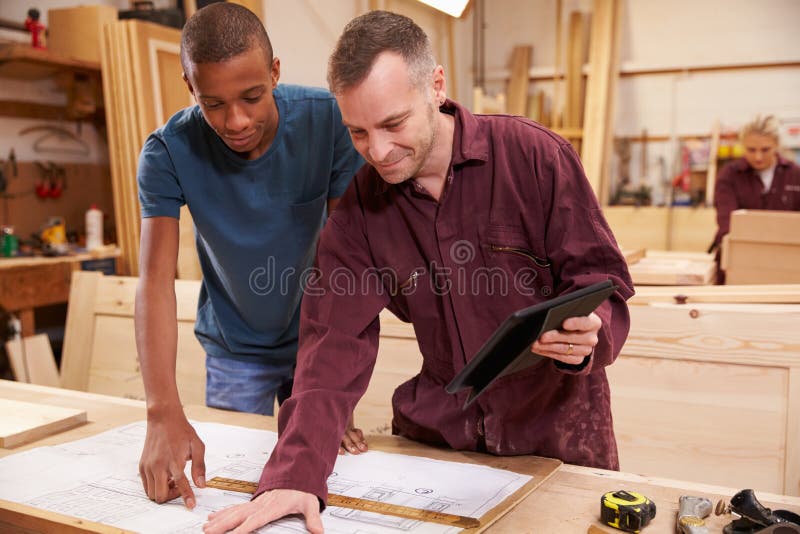Black Men Carpenter Looking Plans Stock Photos - Free & Royalty-Free ...