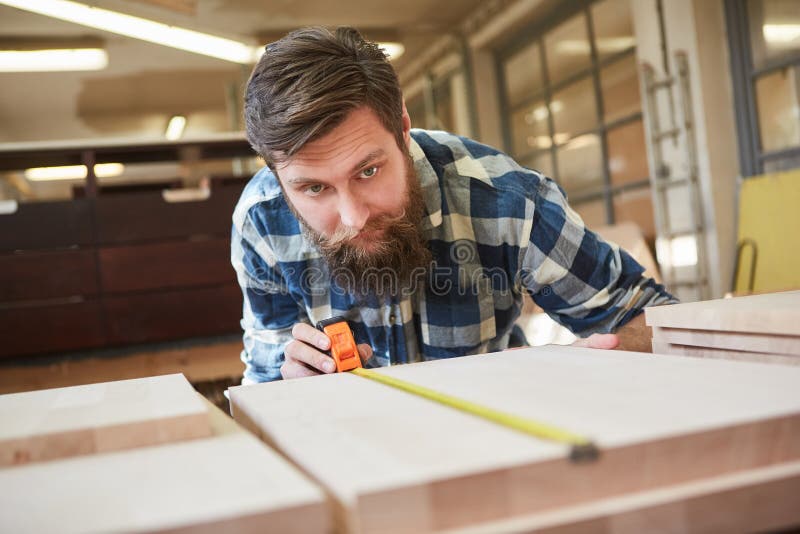 Carpenter Apprentice Measuring Wood Stock Photo - Image of people ...