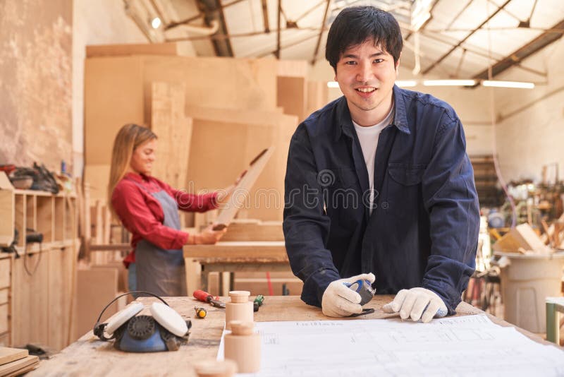 Carpenter Apprentice in Training with Construction Plan Stock Image ...