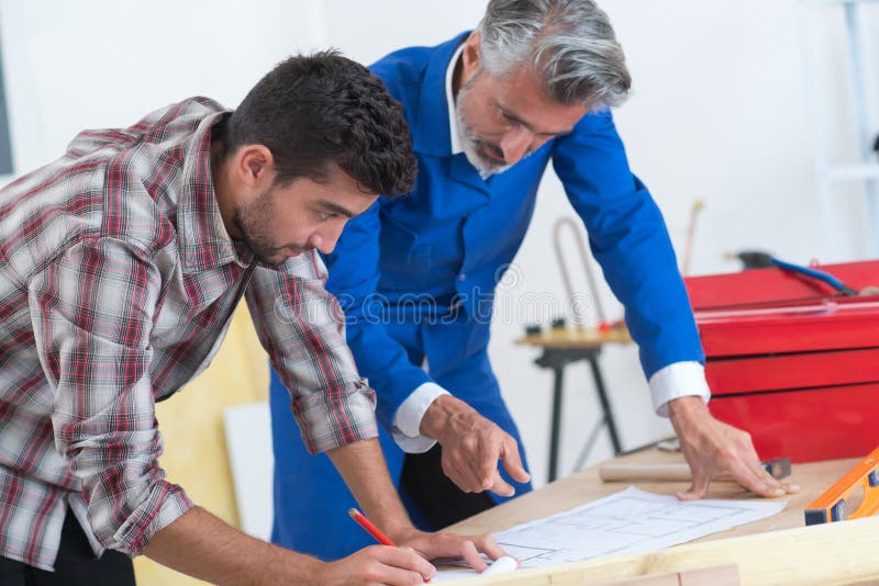 Carpenter and Apprentice in Workshop Stock Image - Image of carpentry ...