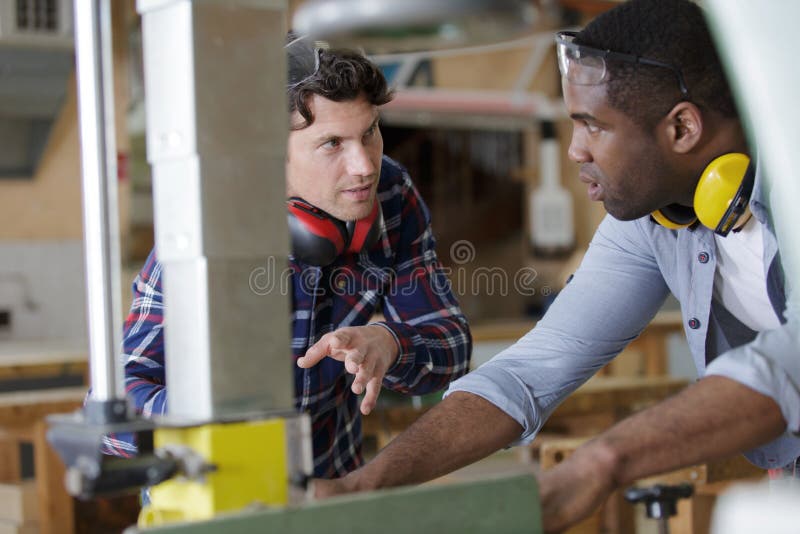 Carpenter and Apprentice in Workshop Stock Image - Image of carpentry ...