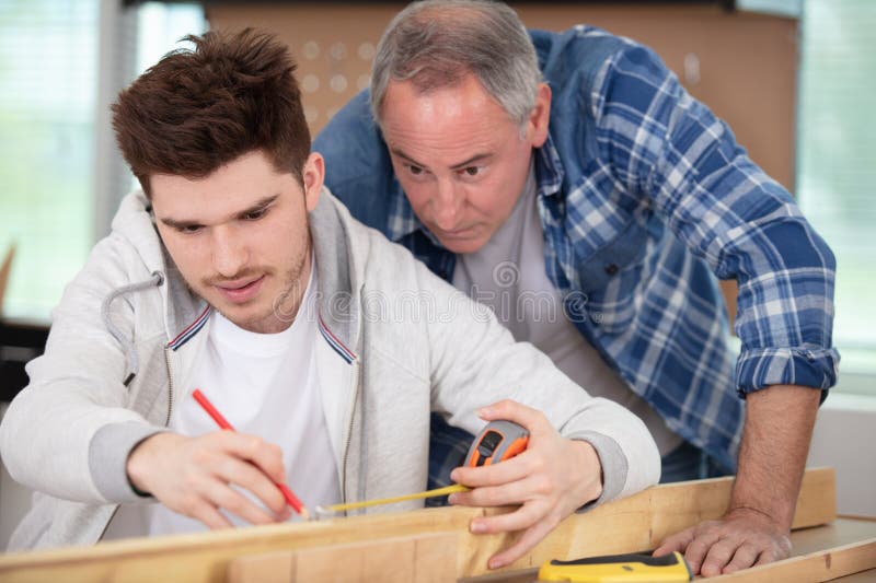 Carpenter with Apprentice in Training Period Stock Photo - Image of ...