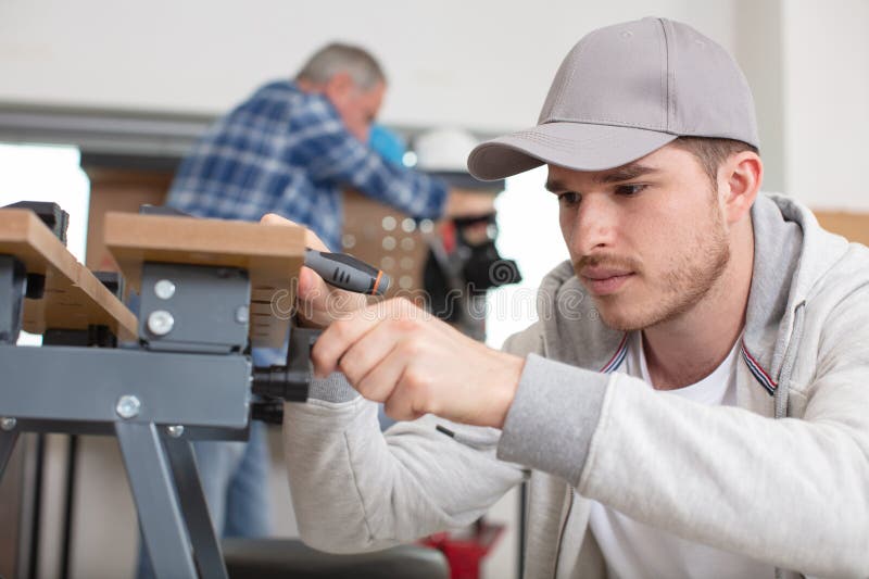 Carpenter with Apprentice in Training Period Stock Image - Image of ...