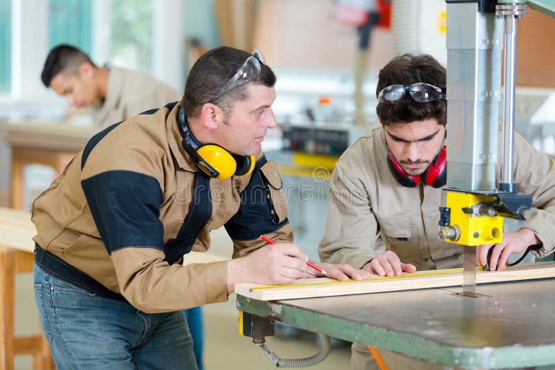 Carpenter and Apprentice in Workshop Stock Image - Image of carpentry ...
