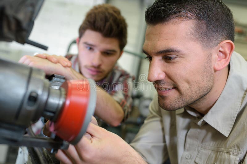 Carpenter and Apprentice in Workshop Stock Image - Image of carpentry ...