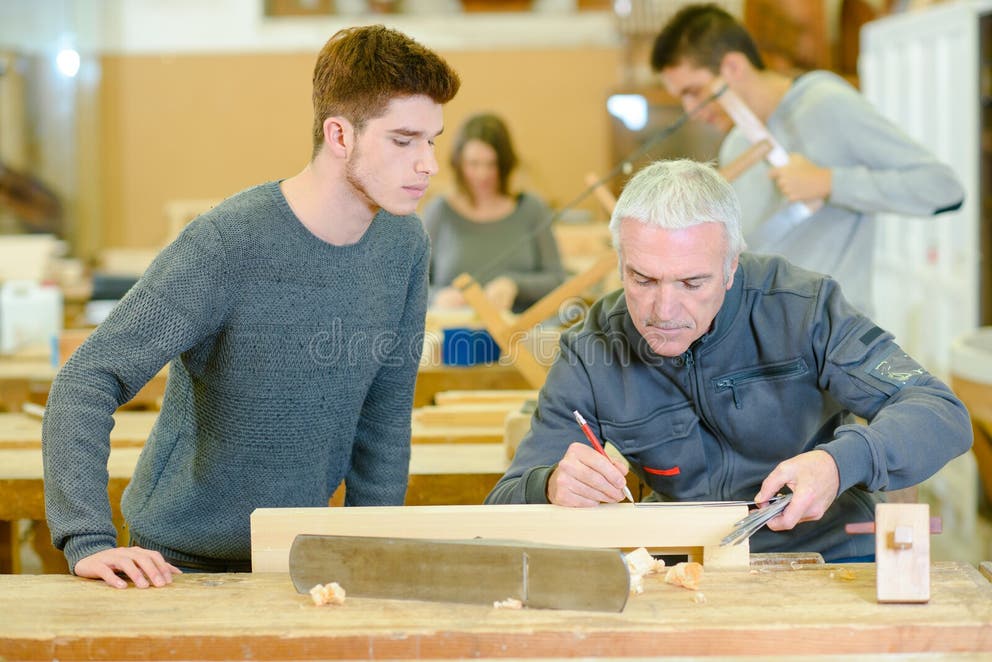 Carpenter and Apprentice in Workshop Stock Photo - Image of labor ...