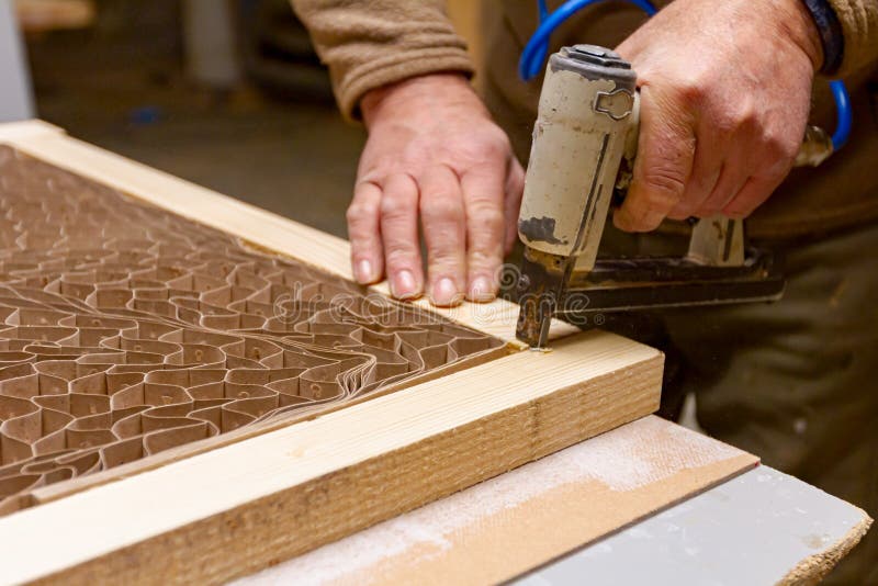 Carpenter Assembles Boards on the Door Frame with Pneumatic Stapler ...