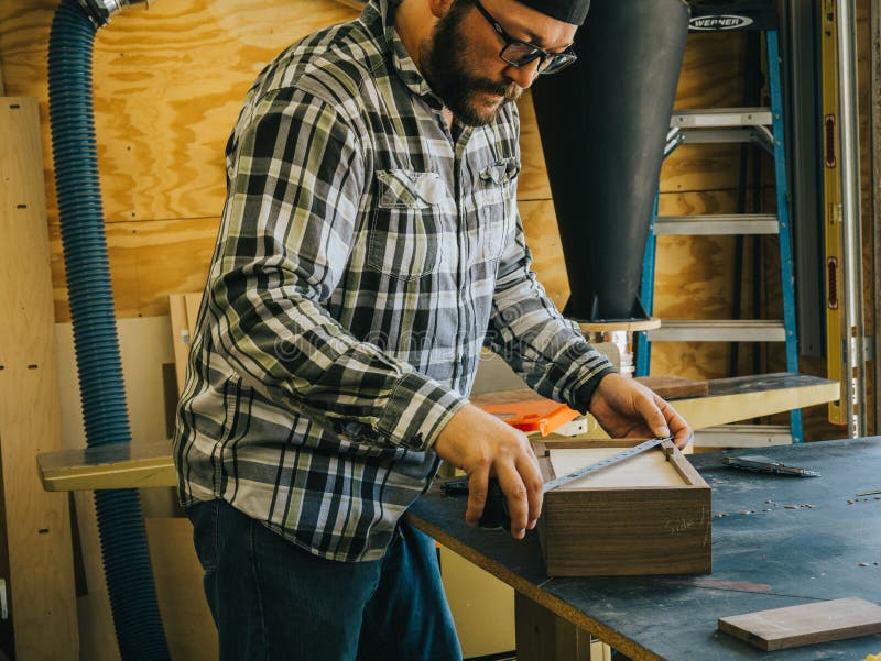 A Carpenter Measuring the Box he is Building Stock Image - Image of ...