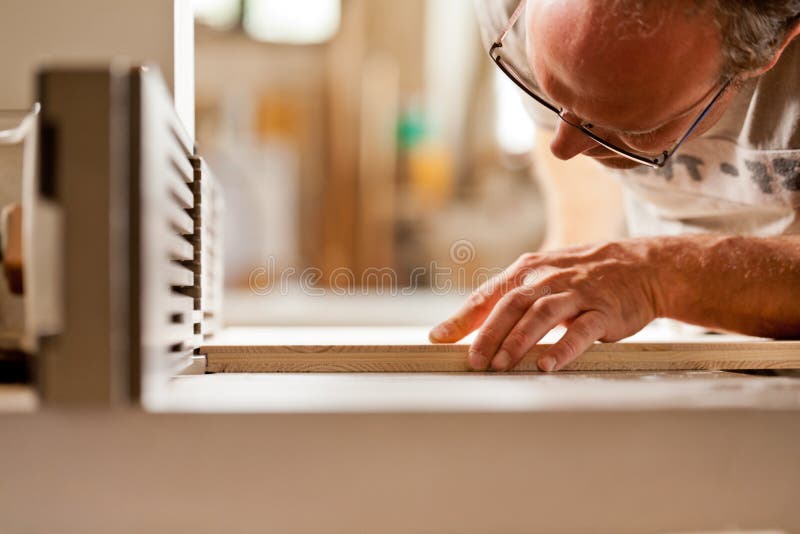 Carpenter Checking Board on a Wood Shaper Stock Image - Image of risk ...