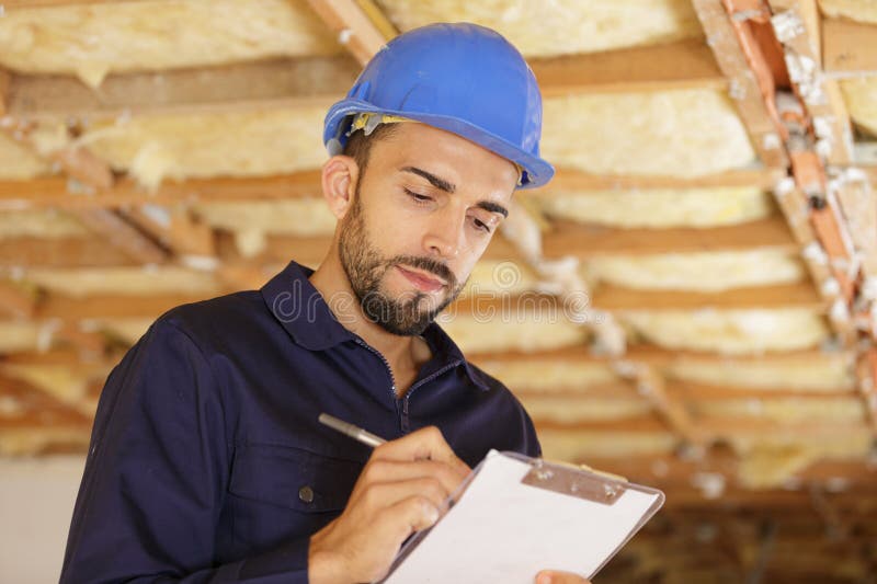 Carpenter Checking Notes at Workshop Stock Image - Image of person ...