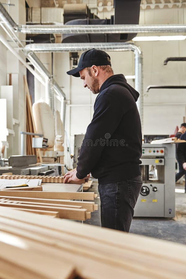 Carpenter Checking His Work. Carpentry and Craftsmanship Concept. Side ...