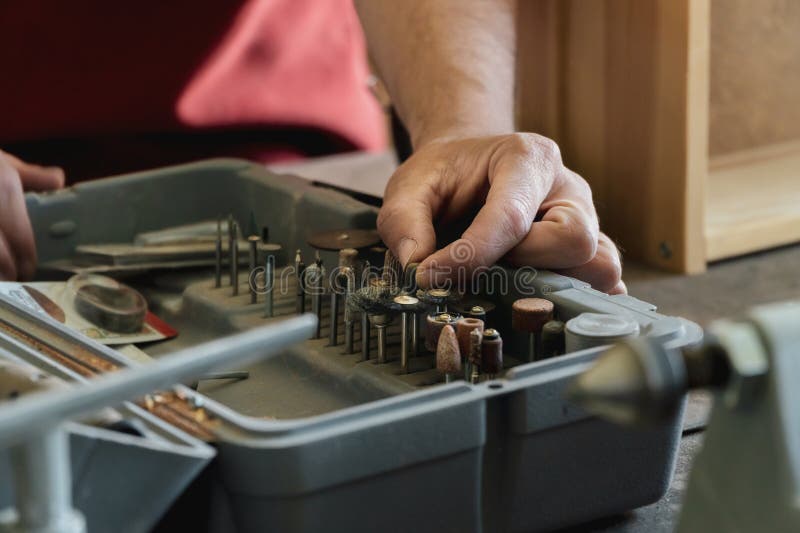 Carpenter Choosing Mini Drill Tools on His Toolbox Stock Photo - Image ...