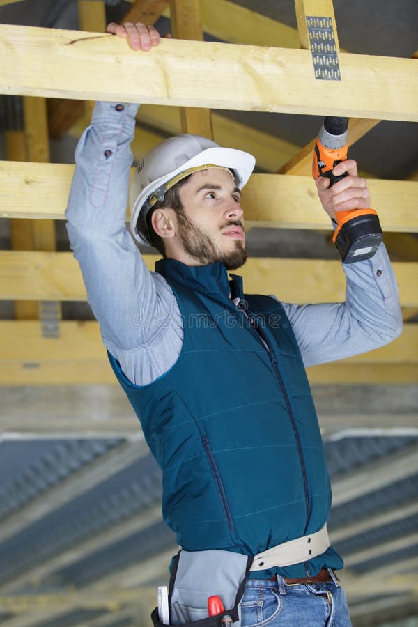 Carpenter in Construction Helmet Fix Clapboard on Ceiling Stock Image ...
