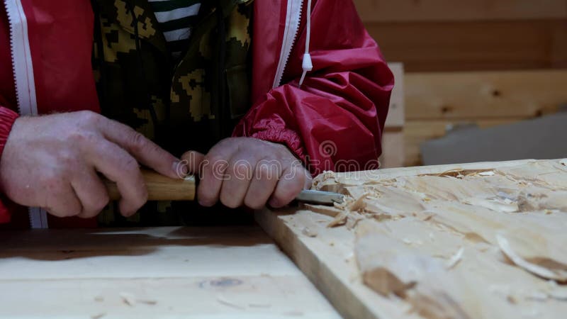 The Carpenter Creates a Panel of Wood. Hands of the Master Close-up ...