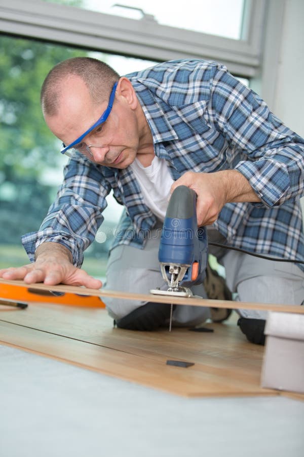 Carpenter Cutting Laminated Planks for Layered Parquet Using Bandsaw ...