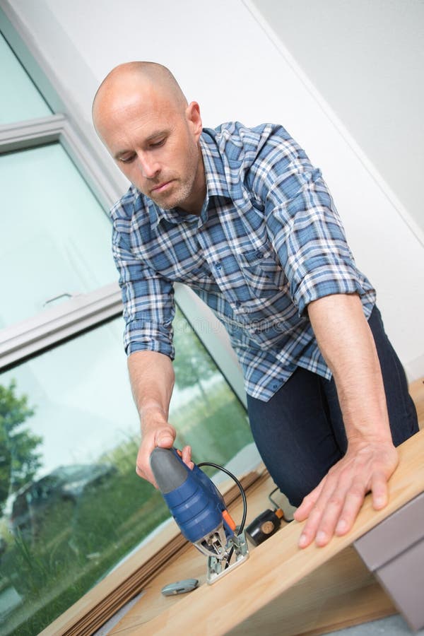 Carpenter Cutting Plank with Jigsaw Stock Photo - Image of operation ...