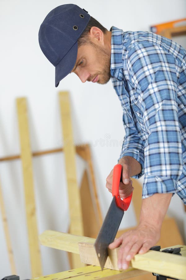 Carpenter Cutting Wood Board Stock Photo - Image of joiner, male: 296715656
