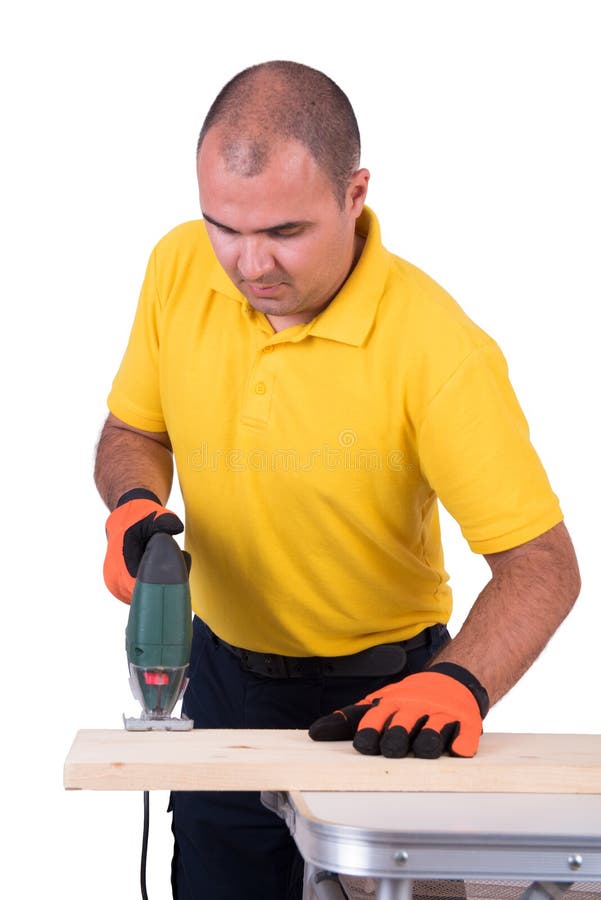 Carpenter cutting wood stock image. Image of workman - 70360539