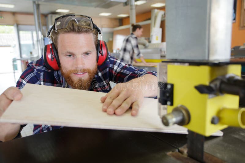 Carpenter Cutting Wood with Machine Stock Photo - Image of industrial ...