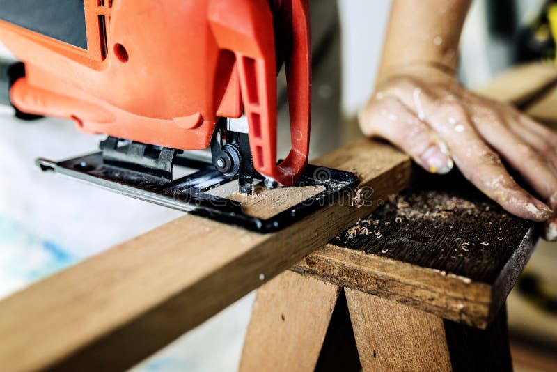 Carpenter Cutting a Wooden Stick Stock Image - Image of housekeeping ...