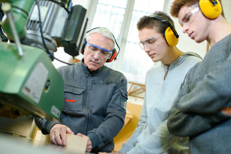 Carpenter Demonstrating Machine To Students Stock Image - Image of ...