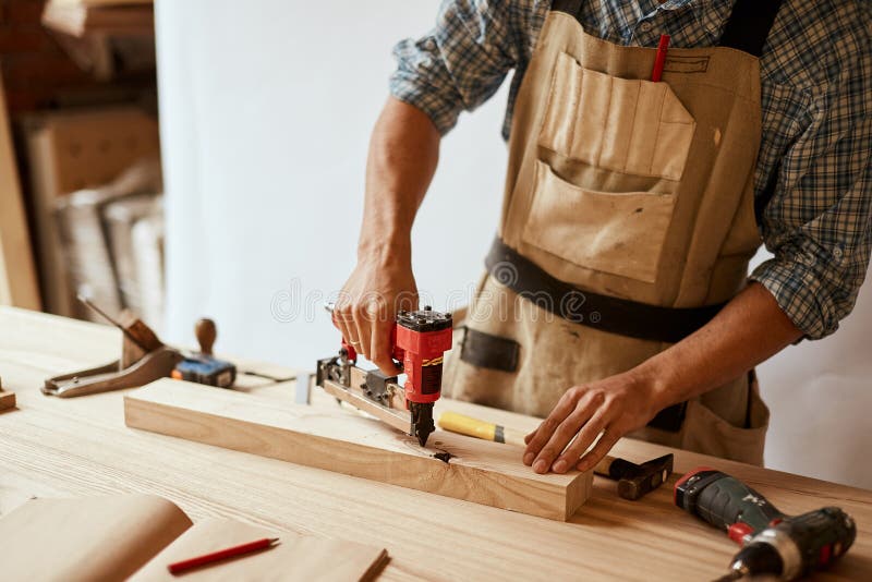 Carpenter Drills a Hole with an Electrical Drill Stock Image - Image of ...