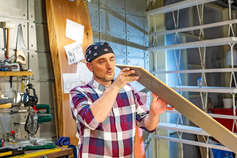 Carpenter Doing His Job in Carpentry Workshop. a Man in a Carpentry ...