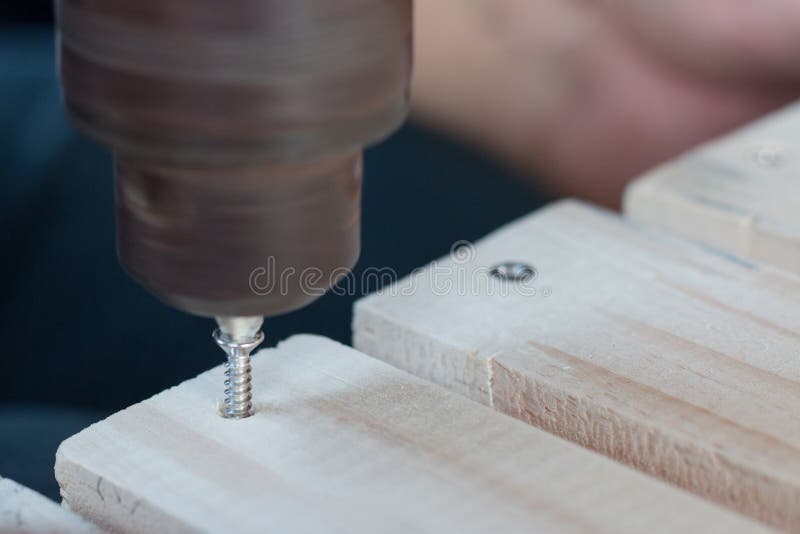 Carpenter Drill a Wooden Board with an Electric Dril Stock Image ...