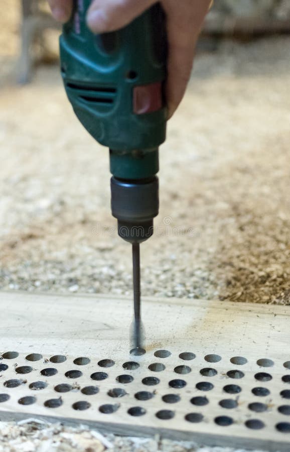Carpenter is Drilling a Board with Drill Stock Photo - Image of ...