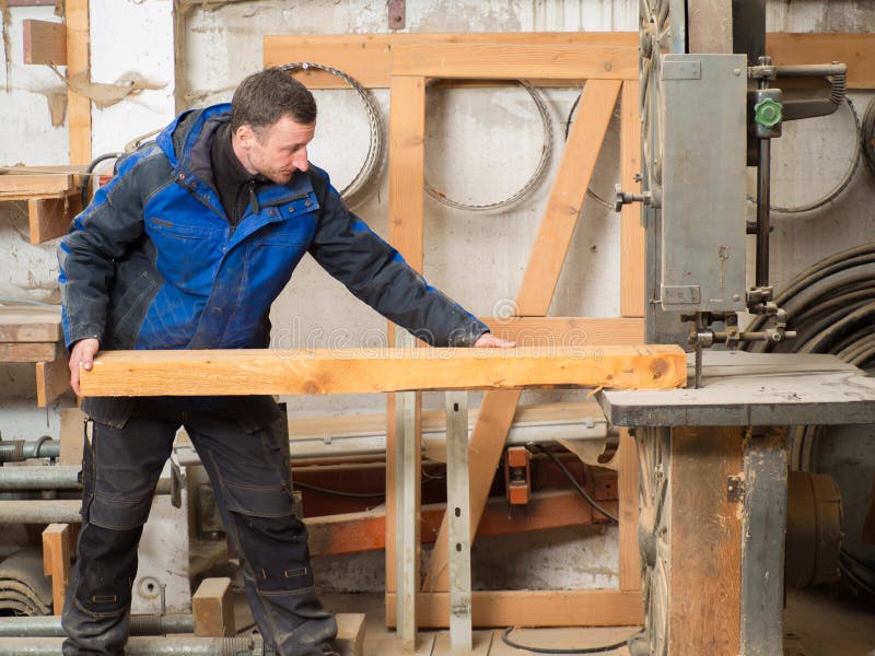 Carpenter on an Electric Saw Machine Stock Photo - Image of factory ...