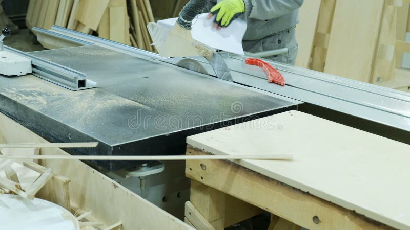 Carpenter Examines Drawings with Dimensions on the Background of Modern ...