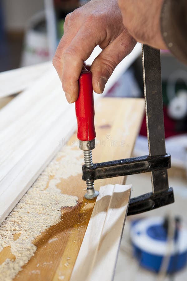 Carpenter Fastening a Clamp Stock Image - Image of clamp, piece: 64184071