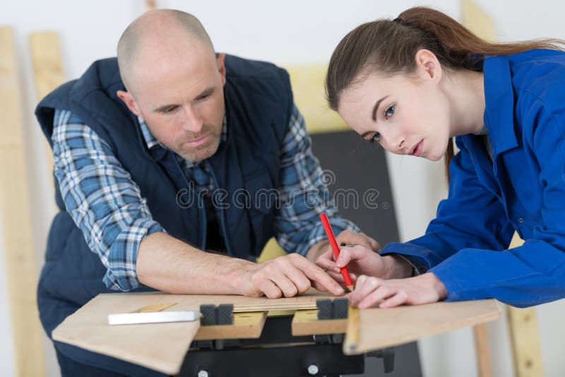 Carpenter with Female Apprentice in Training Period Stock Image - Image ...