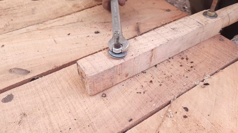 A Carpenter Fixing Handle of Thela Gadi Wheelbarrow by Nut Bolt Fitting ...